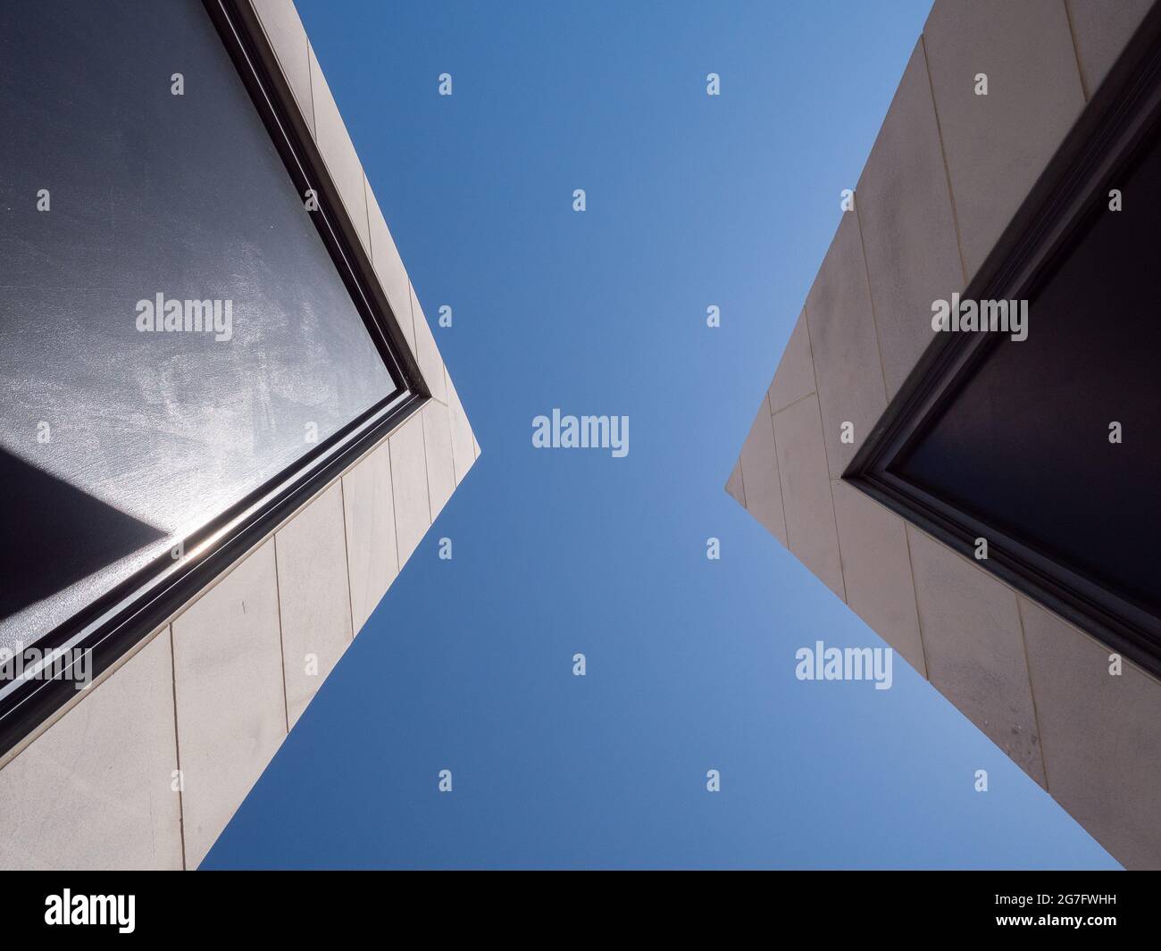 Low angle view of modern buildings with big black window frames in the ...