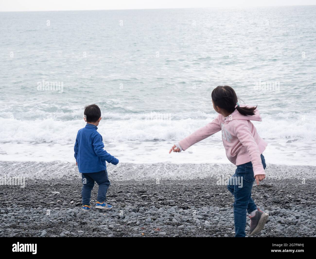 Children throwing stones hi-res stock photography and images - Alamy