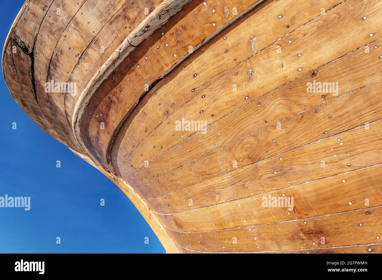 wooden ship's hull was stripped of all of its protective coats in order ...