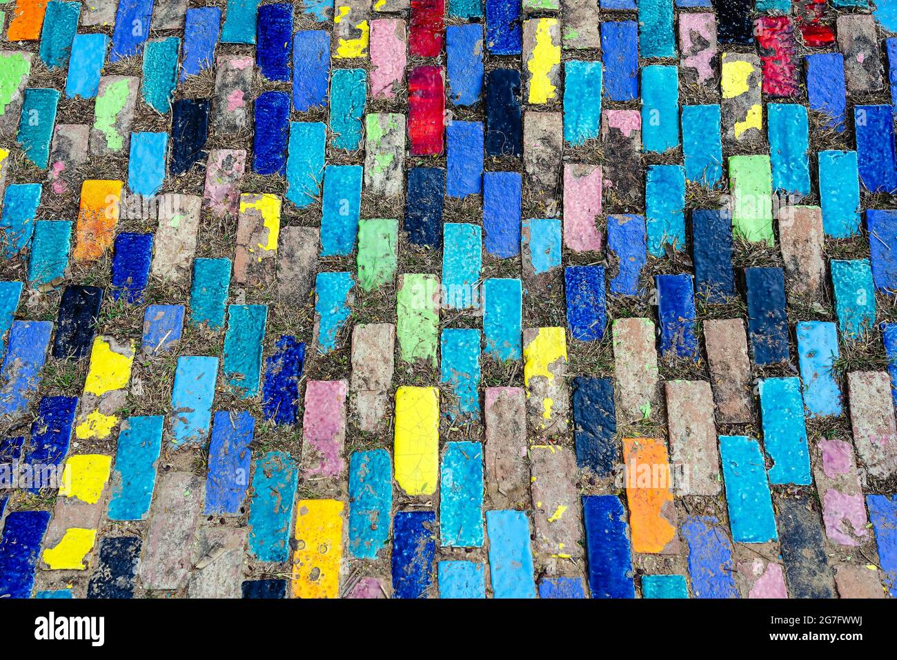 Top view on pieces of multicolored ceramic tiles decorated in garden ...