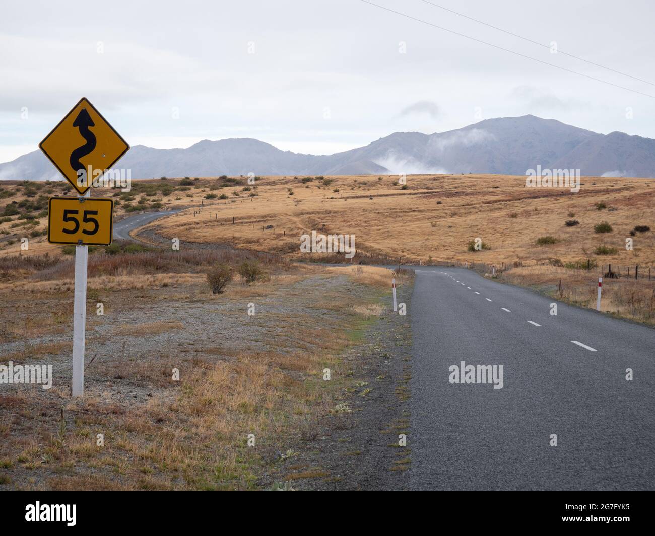 View of a curving highway passing through a deserted area Stock Photo ...
