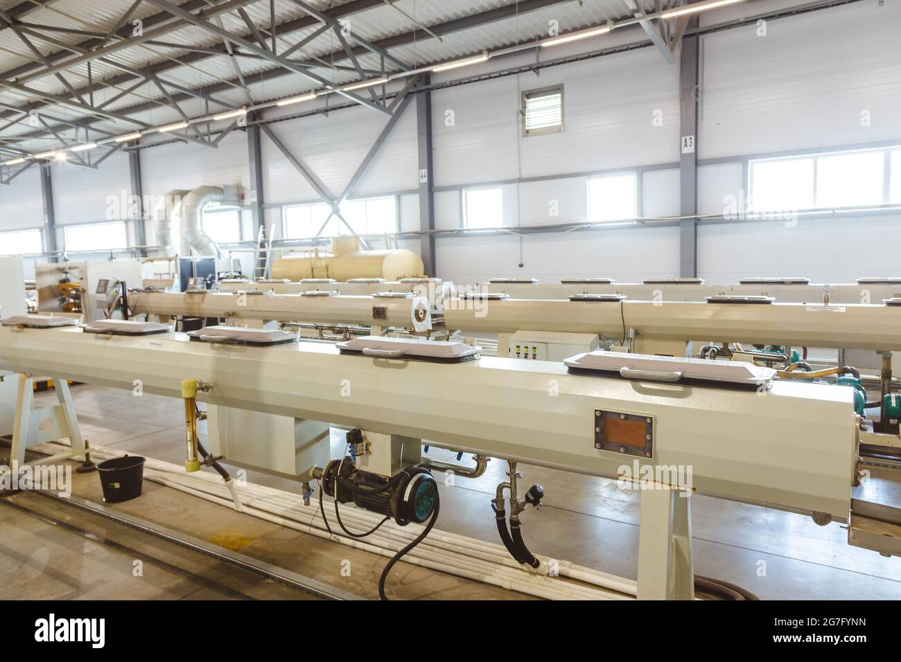 Workshop with extruders for producing plastic pipes. High speed ...