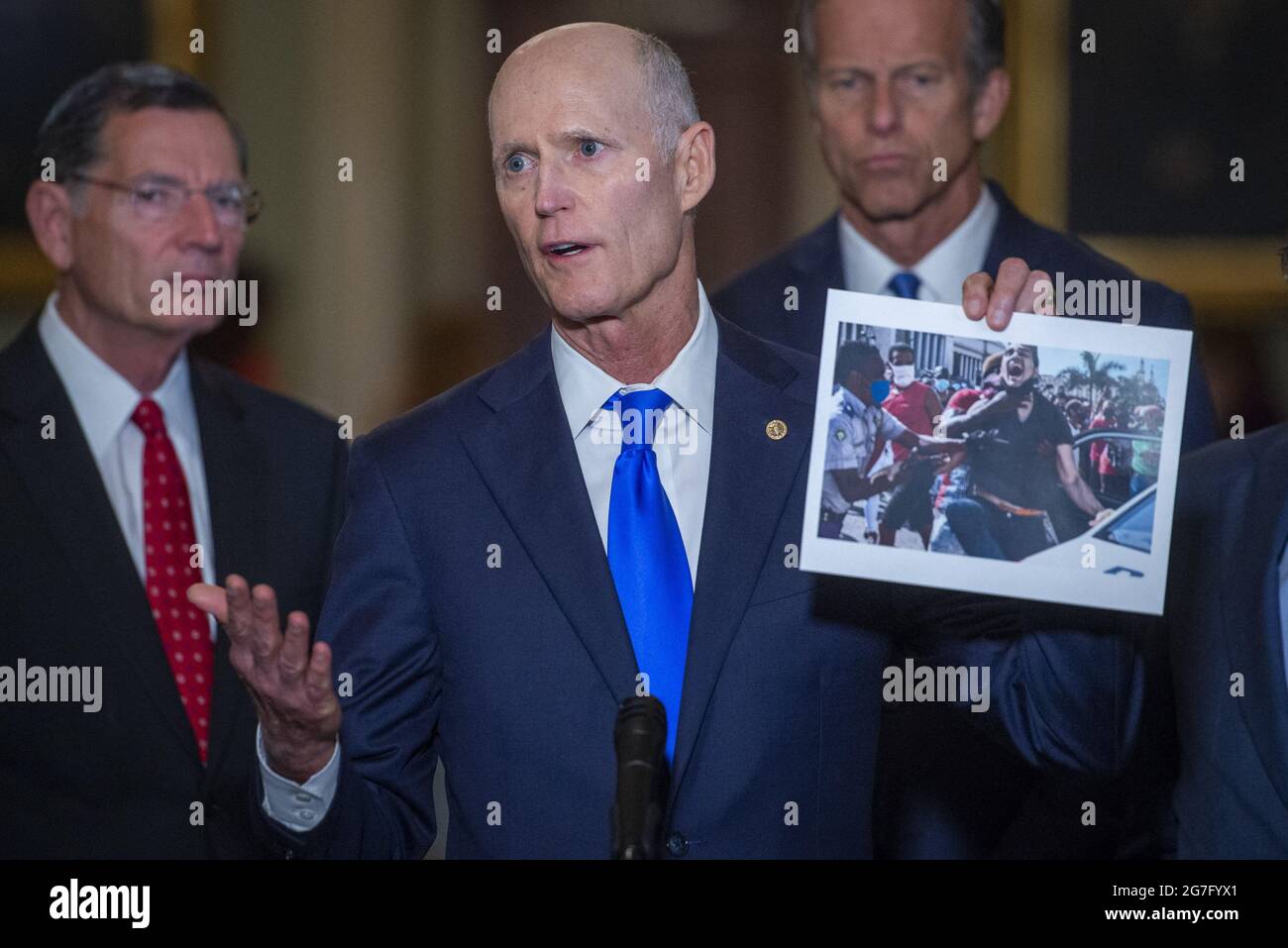 United States Senator Rick Scott (Republican of Florida) holds up a ...
