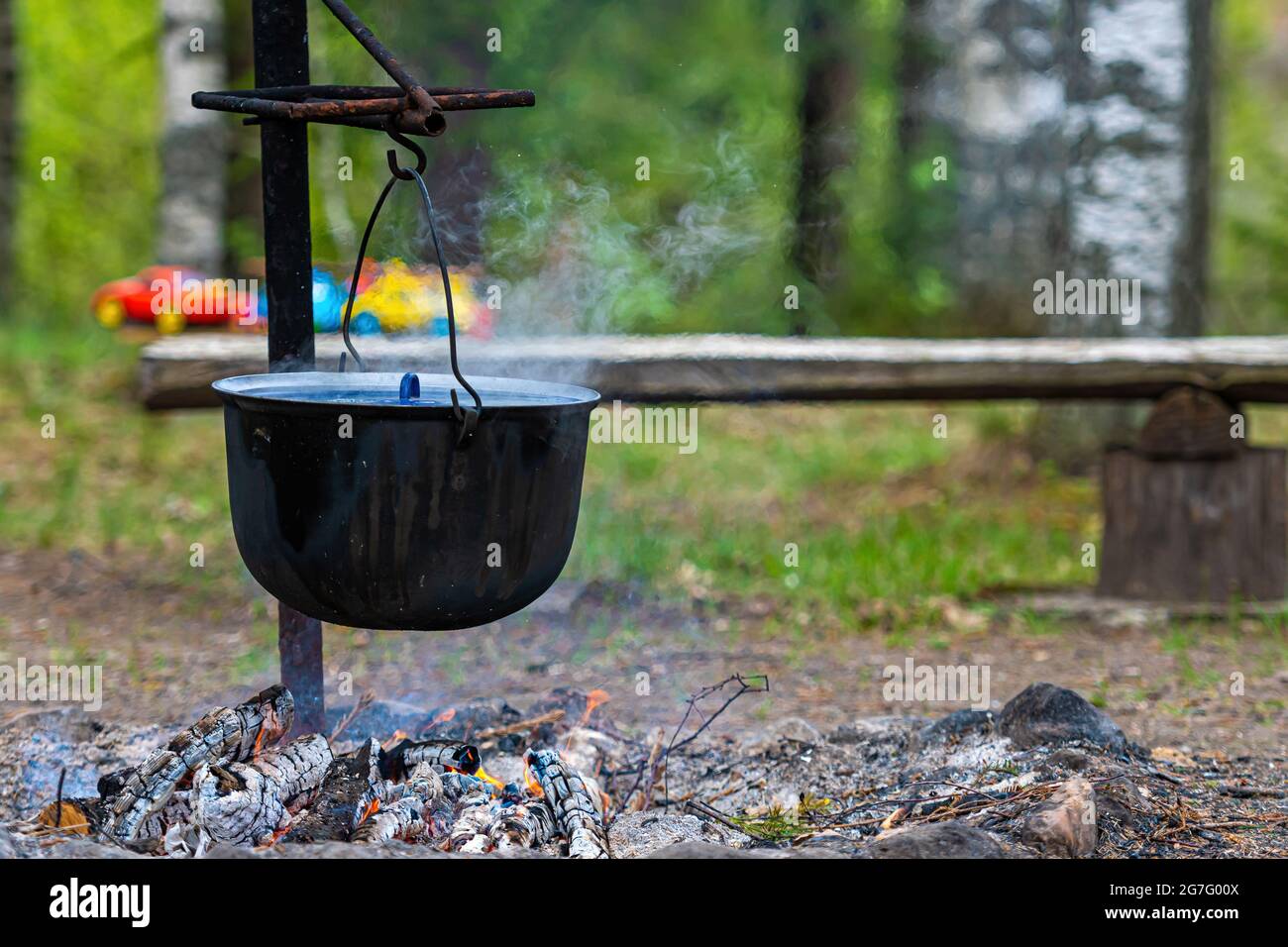 cooking food on a campfire in the woods, food camping concept, place ...
