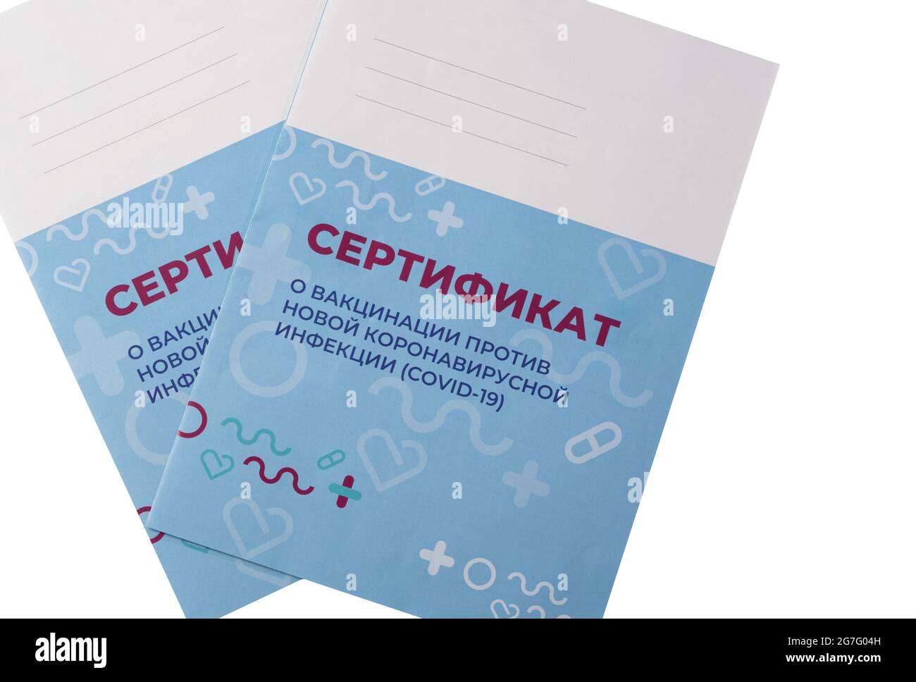 Close-up two certificates of vaccination. Translation: certificate of ...