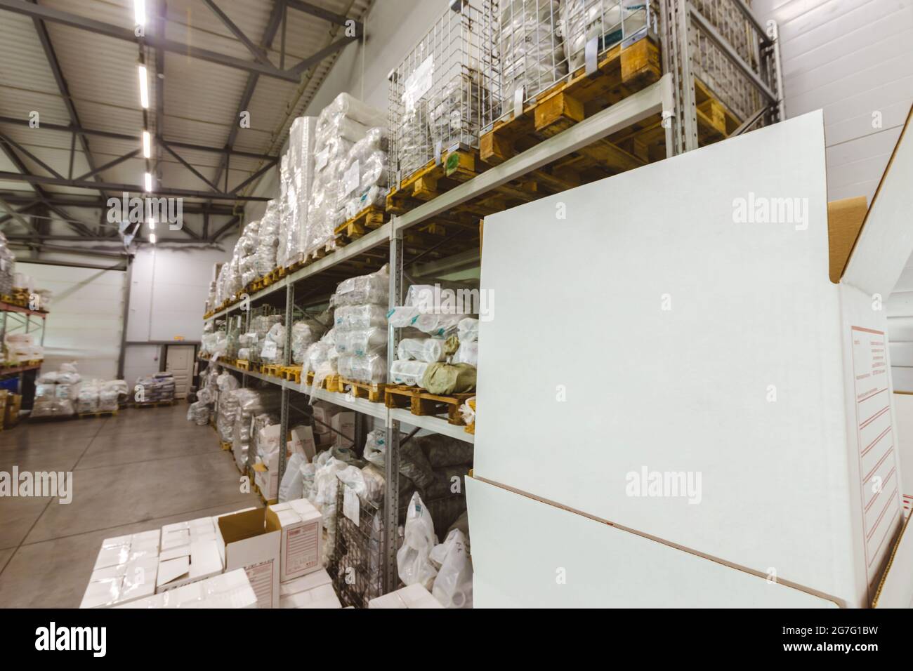 Spacious light interior of a large warehouse in a factory with special ...