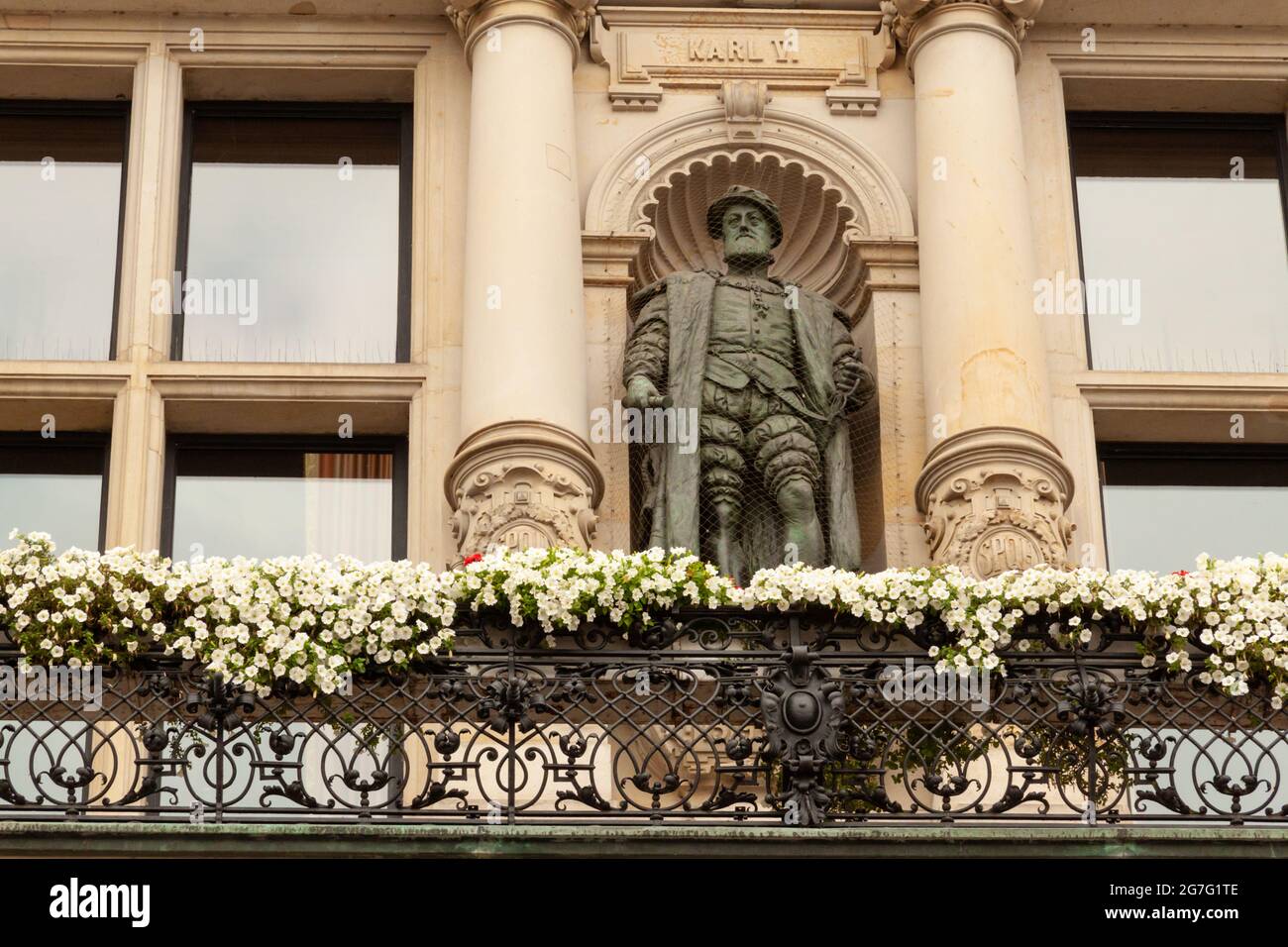 Sculpture of ancient Hamburg merchant on townhall facade Stock Photo ...