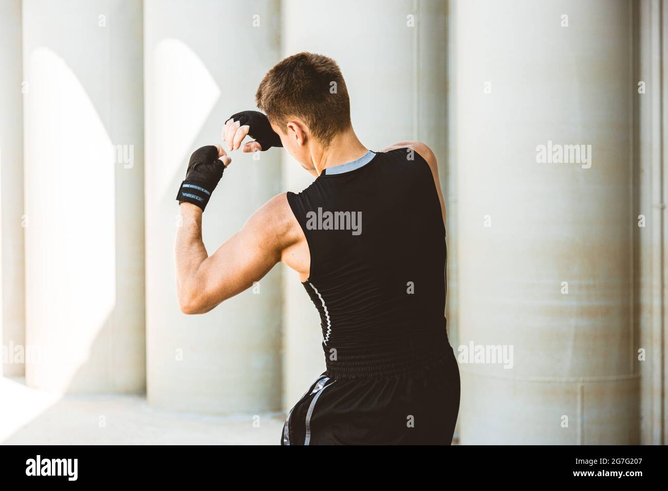 Man exercising and fighting in outside, boxer in gloves. male boxer ...
