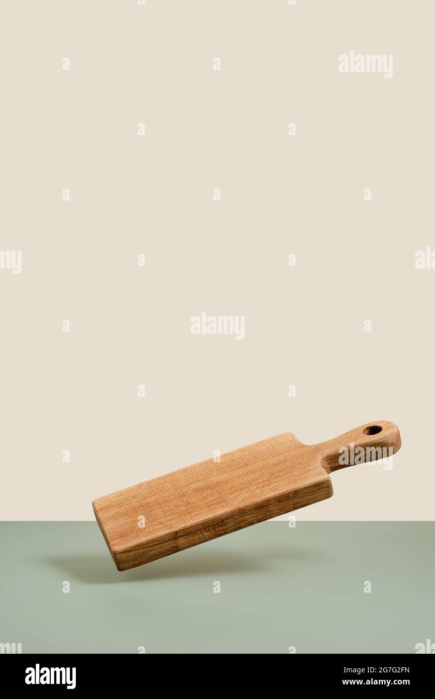 Levitating wooden cutting board Stock Photo - Alamy