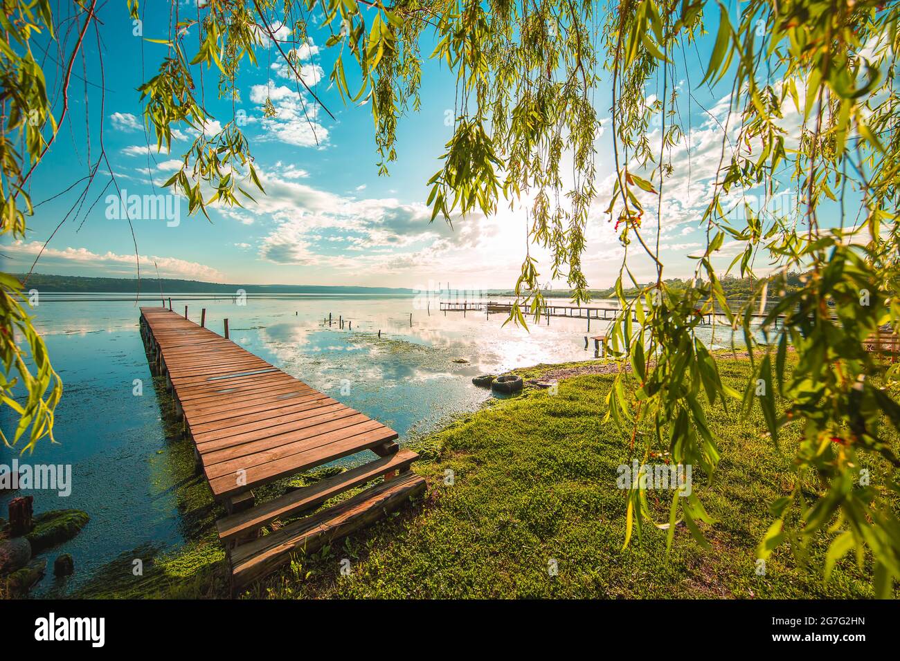 Small Dock and Boat at the lake Stock Photo - Alamy