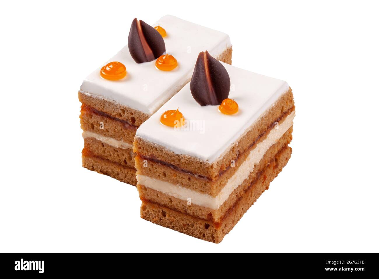 Two slices of cake with jam, cream cheese buttercream and sugar icing ...