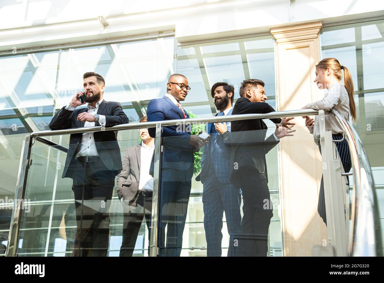 young business people are standing and talking on the background of ...