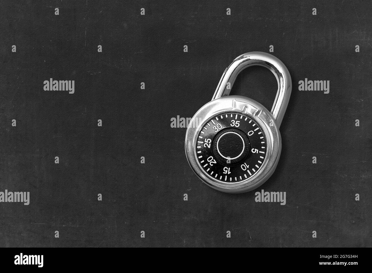 Padlock on black background Stock Photo - Alamy