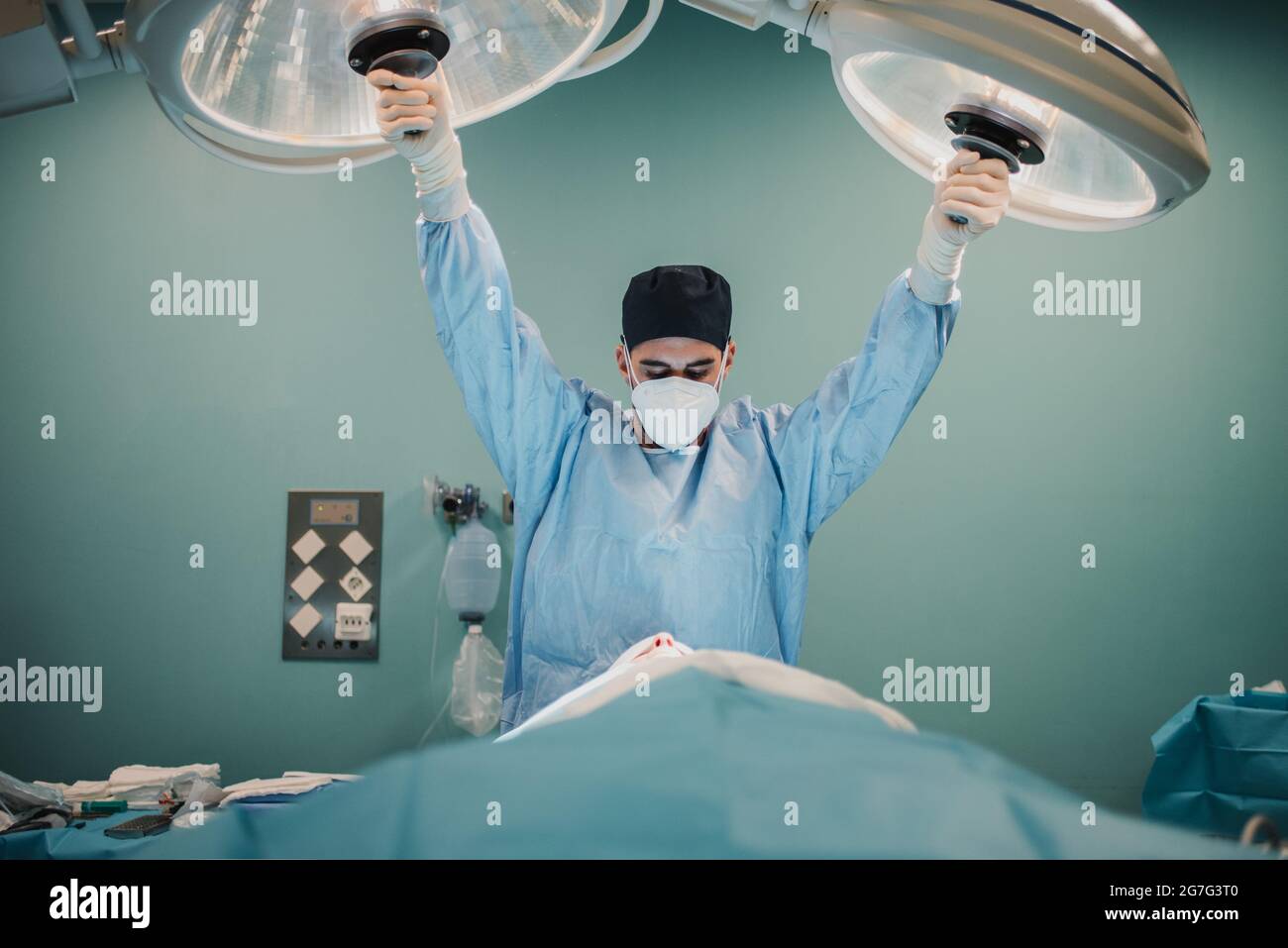 Medical doctor preparing to perform surgery inside emergency hospital ...