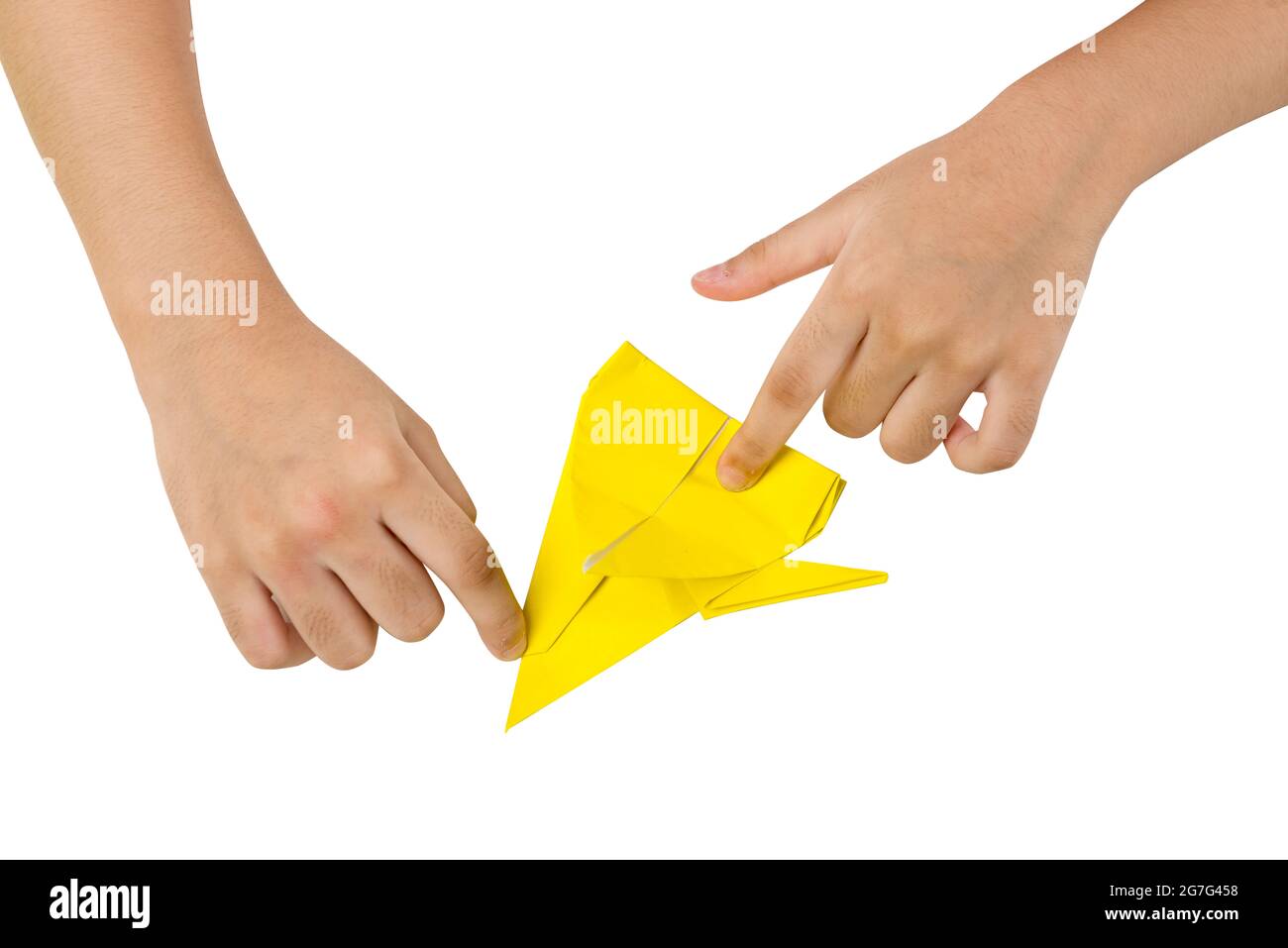 Little girl folding a paper isolated over white background Stock Photo ...
