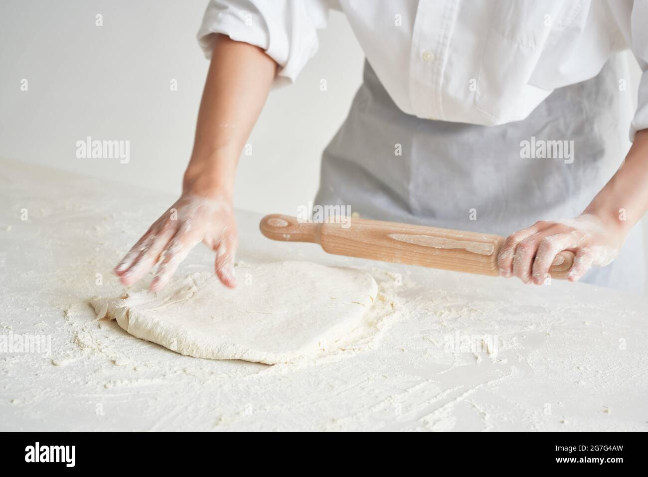 woman chef rolls out dough bakery cooking pastry Stock Photo - Alamy