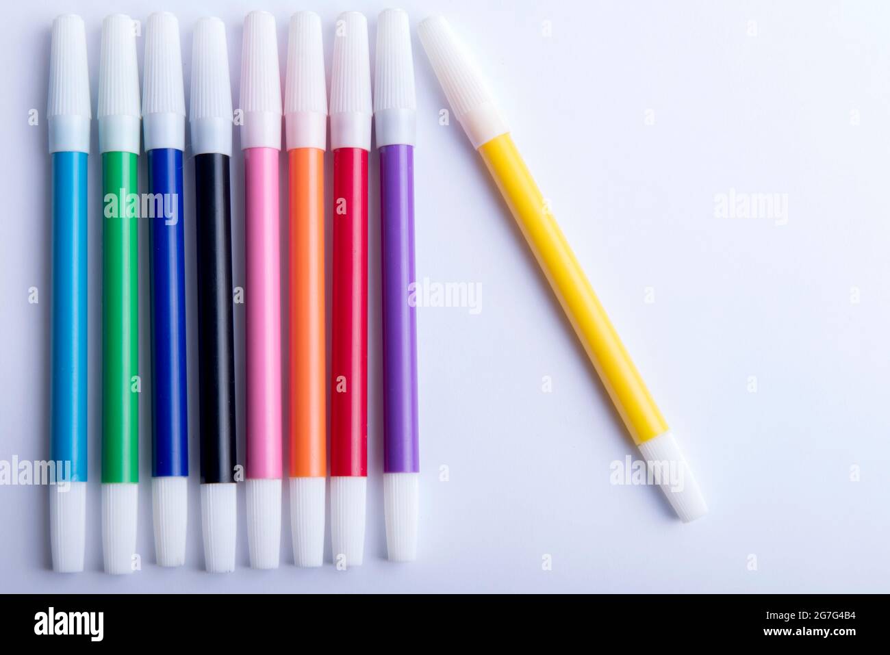 Colorful markers on white background Stock Photo - Alamy