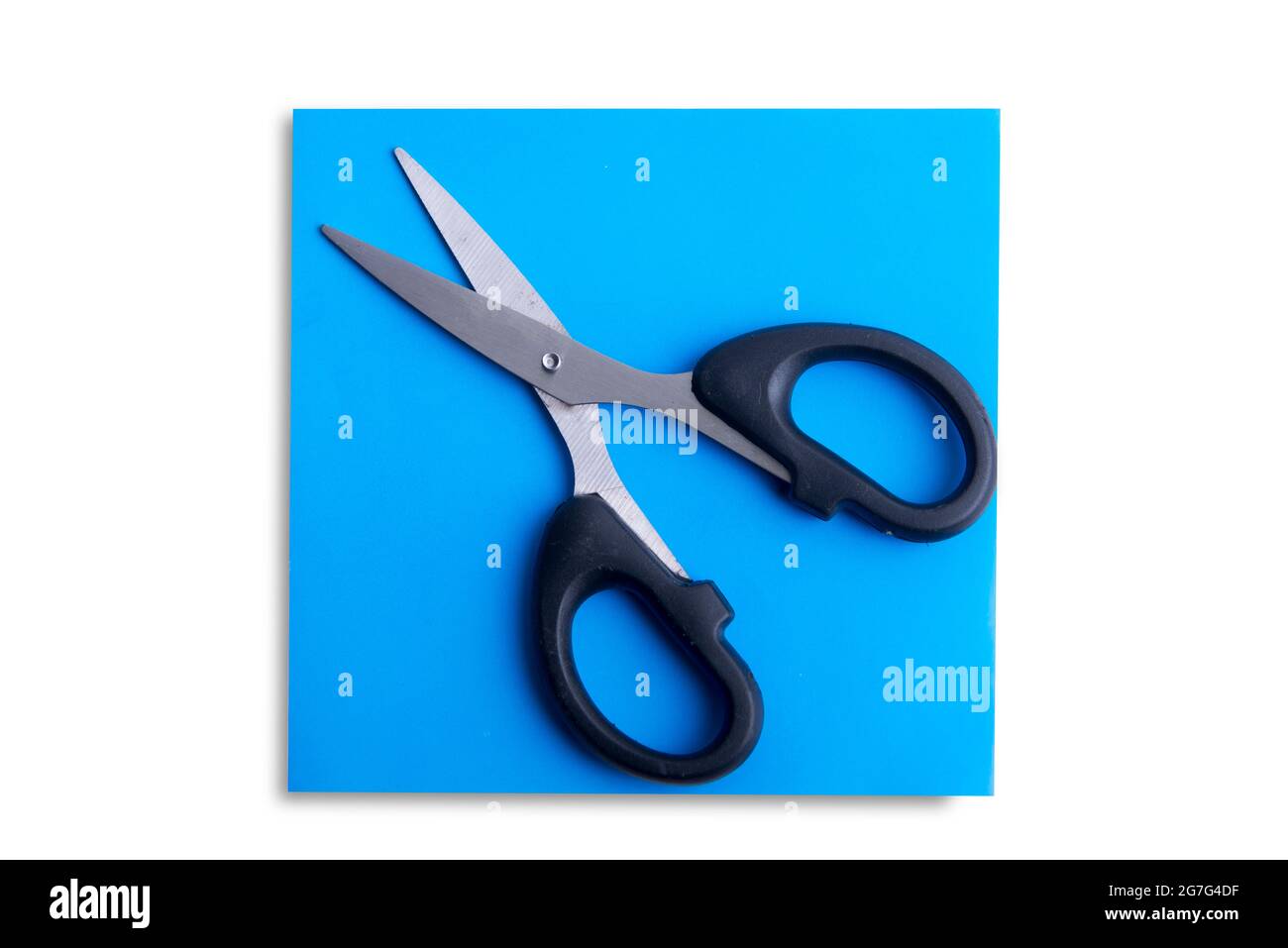 Colored paper with scissors isolated over white background Stock Photo ...