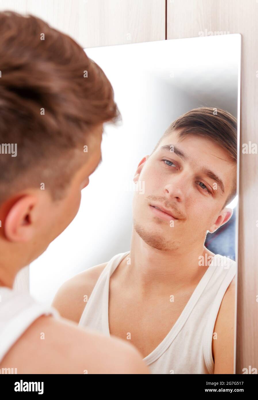 Person staring in mirror hi-res stock photography and images - Alamy