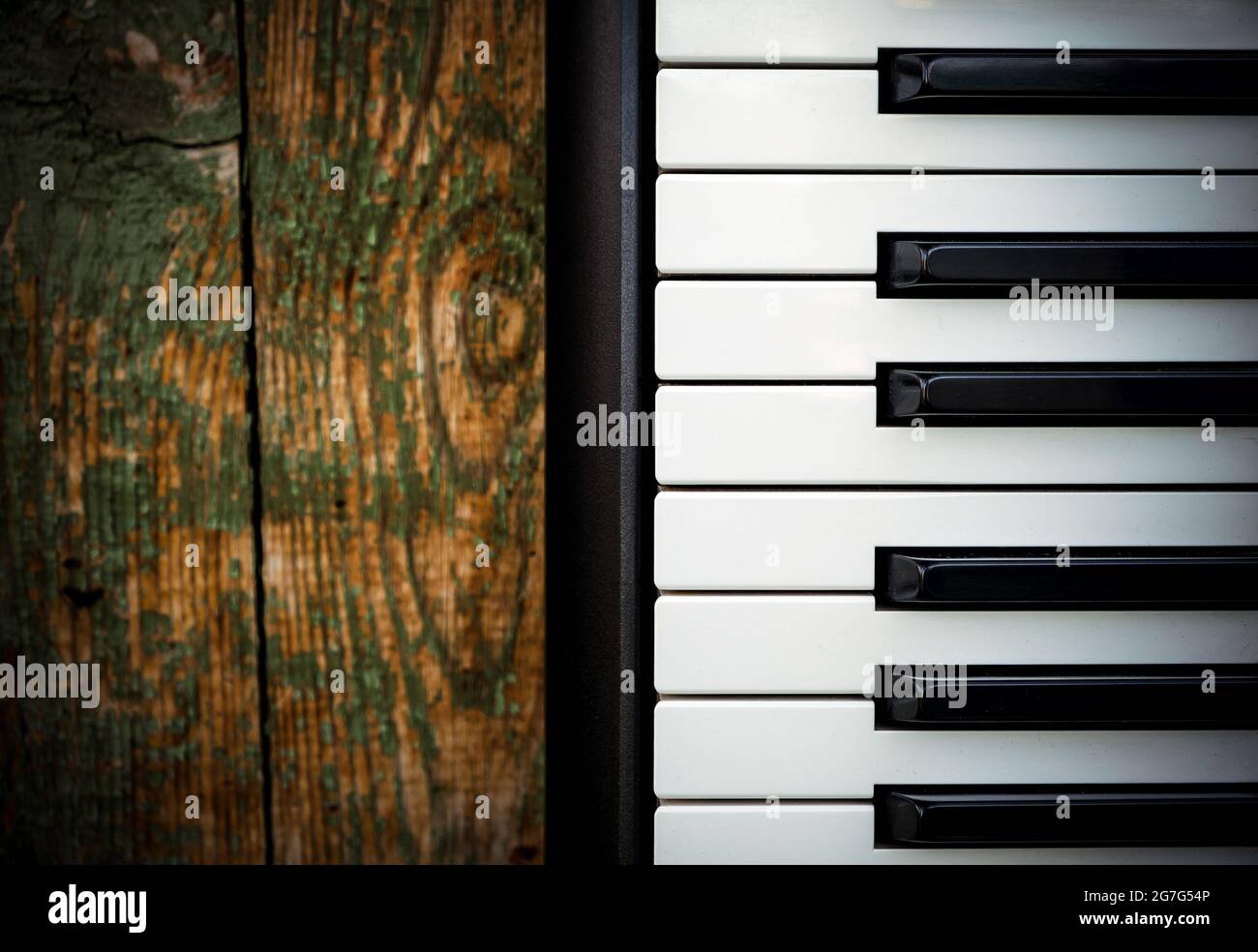 Piano Keyboard on the Old Wooden Planks Background closeup Stock Photo ...