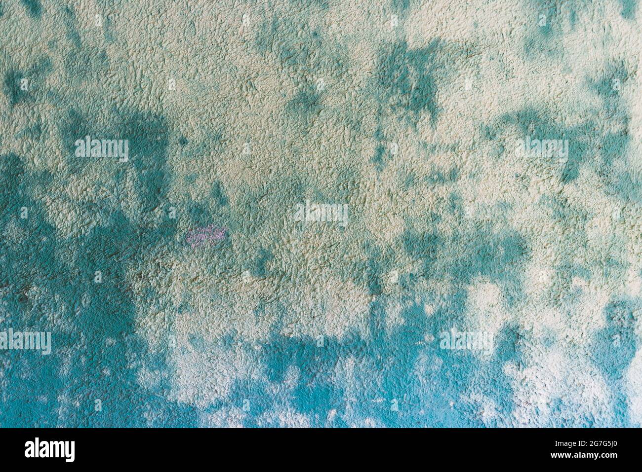 Blue green spoted exposed wall texture.Empty old stained art texture of ...