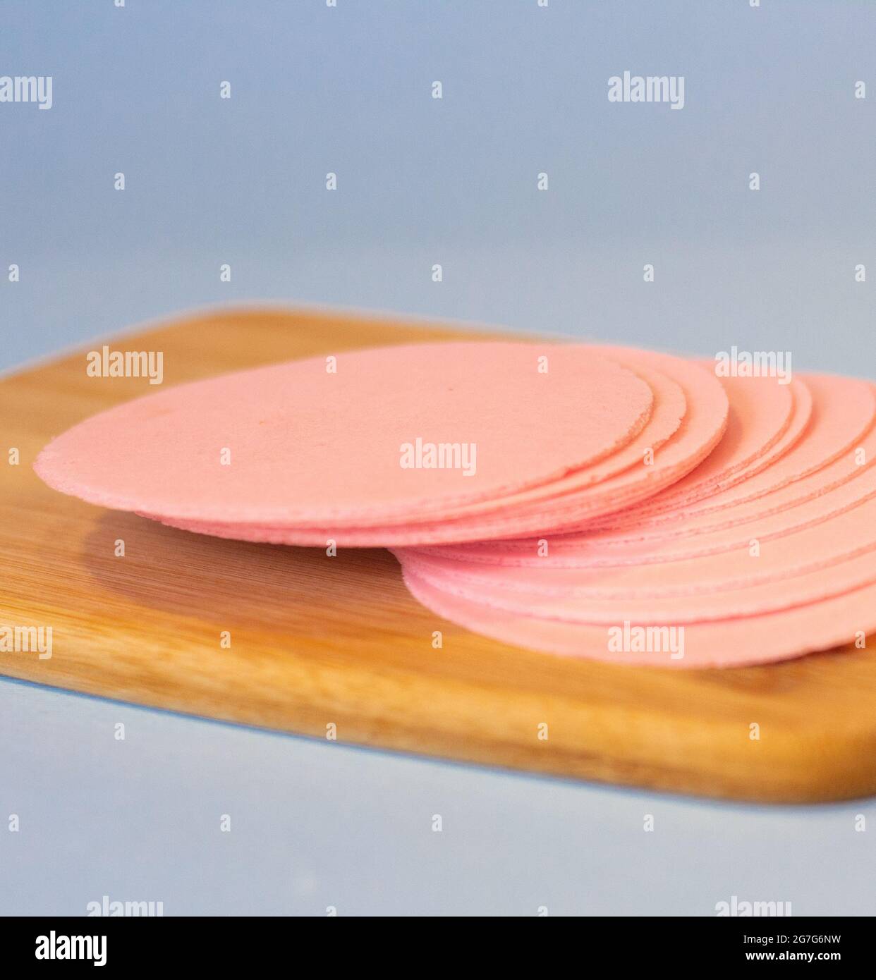 strawberry wafers on a wooden board isolated on a blue background ...