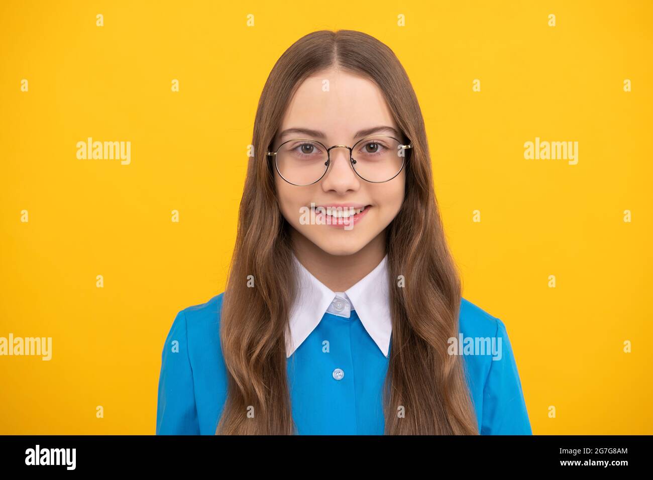 Tween girl. Happy girl child in eyeglasses yellow background. Girls ...