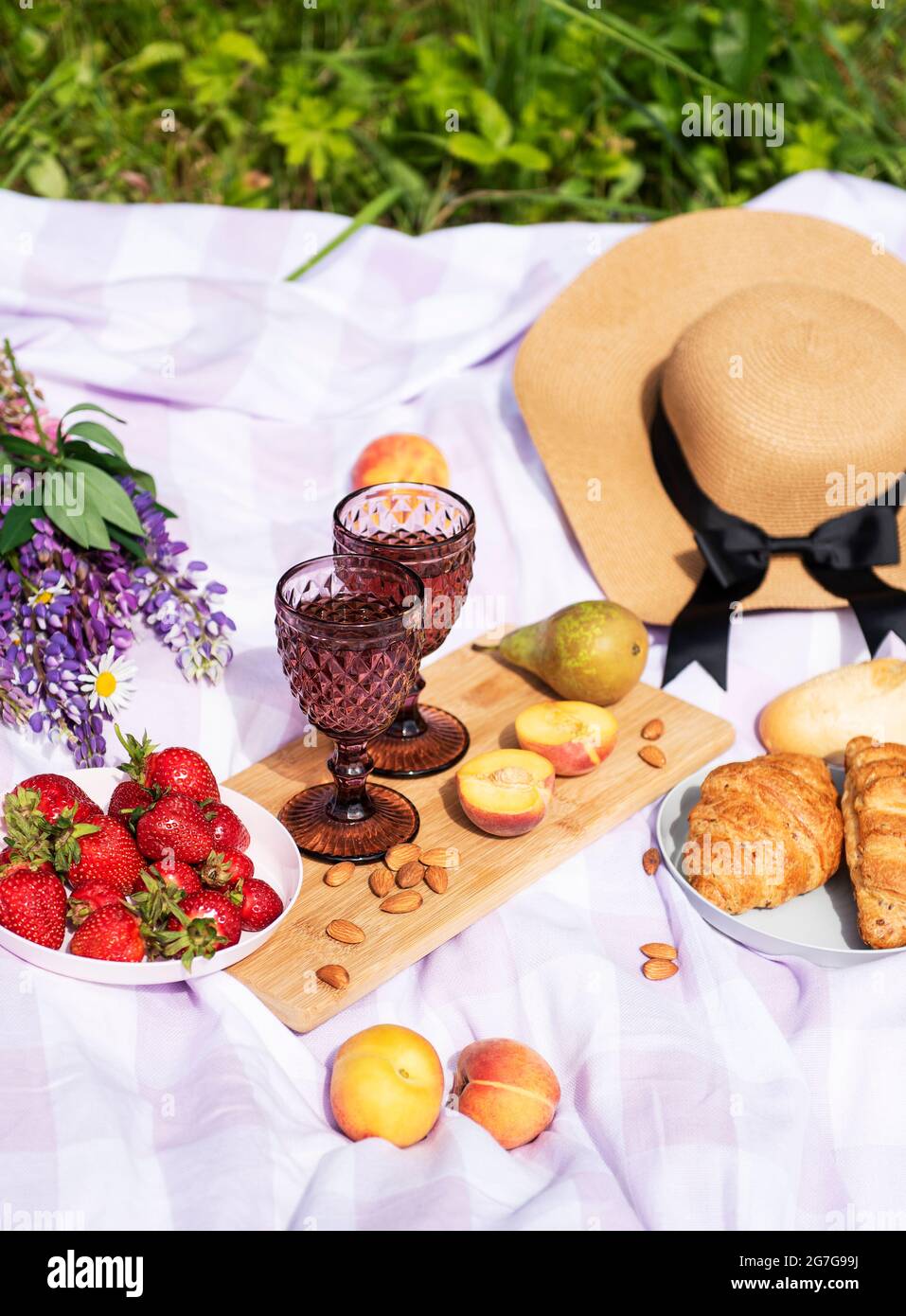 Romantic picnic scene on summer day. Outdoor picnic with wine and a ...