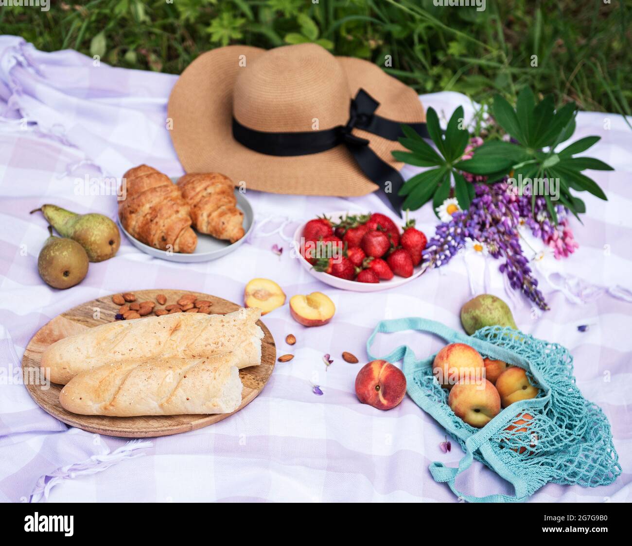 Romantic picnic scene on summer day. Outdoor picnic with wine and a ...