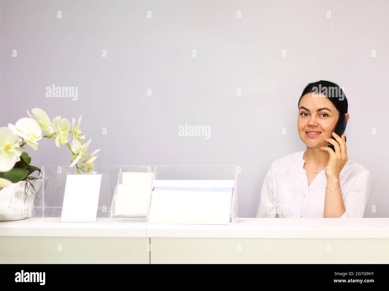 Medical receptionist phone hi-res stock photography and images - Alamy