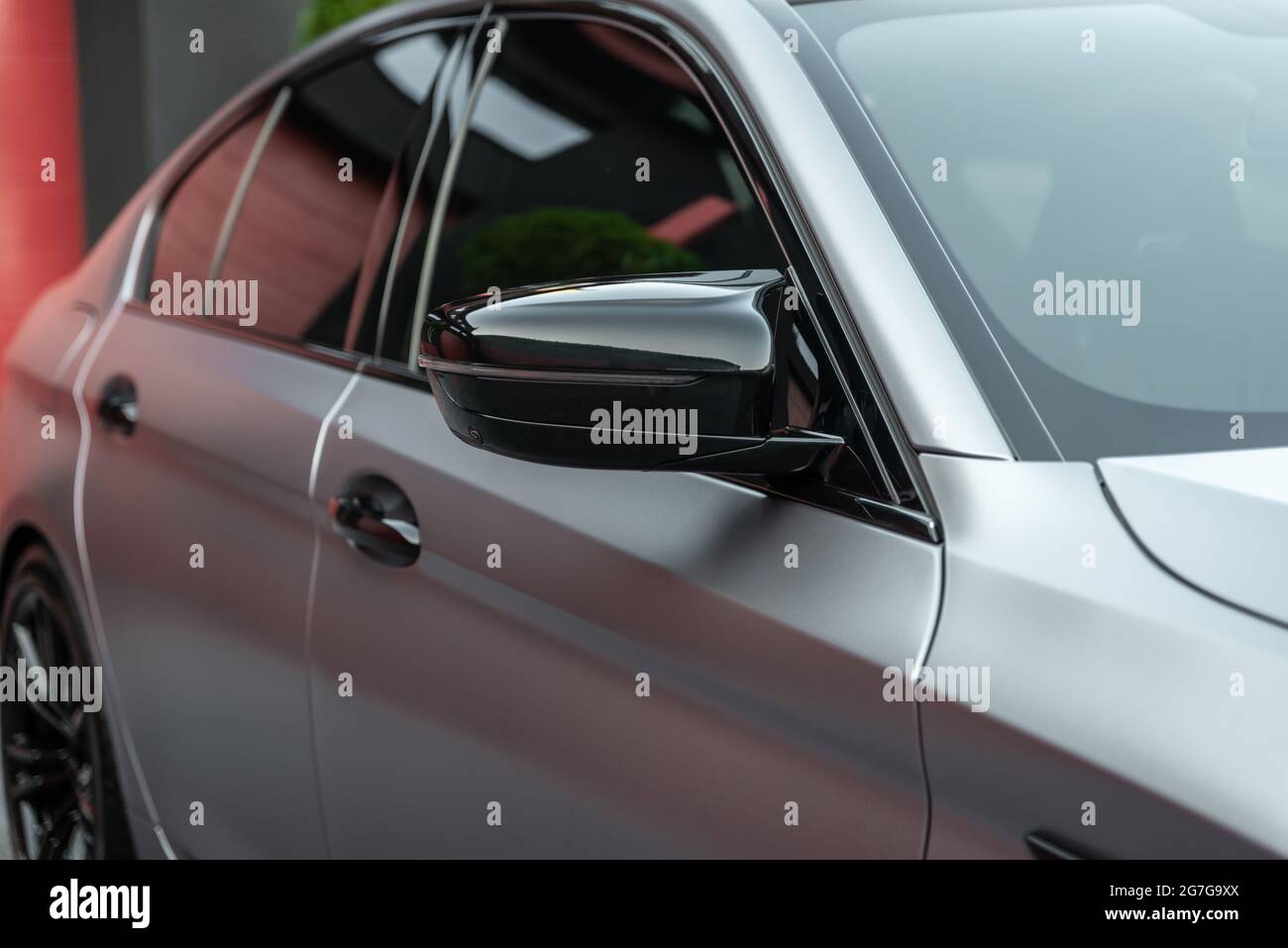 Front side view of the metallic color modern sports car close up ...