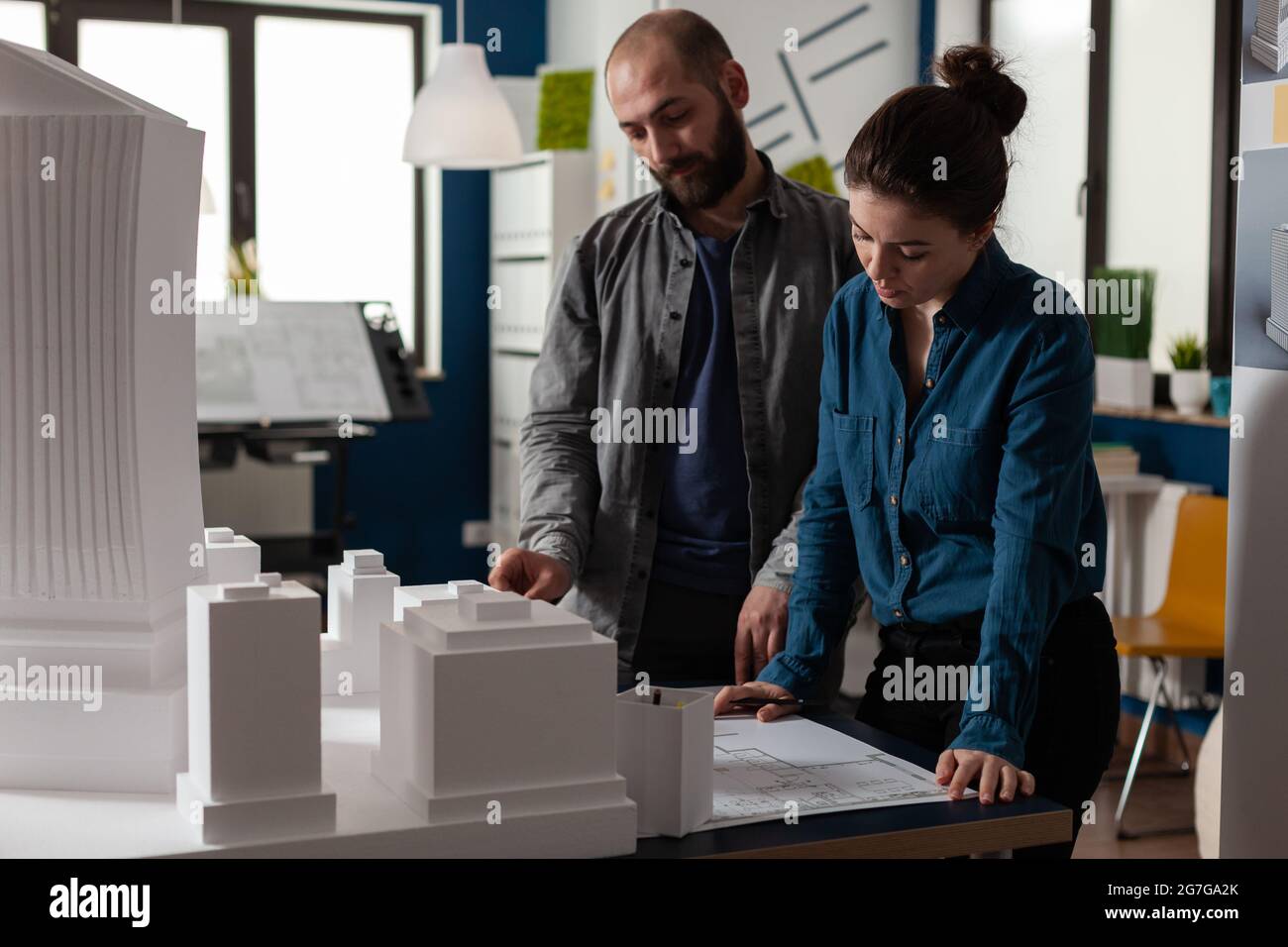 Construction architect team working at desk office on blueprint layout ...