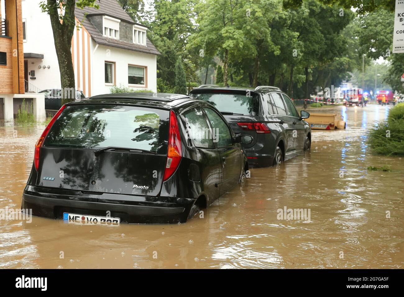 Erkrath, Germany. 14th July, 2021. Cars stand in the water on the ...