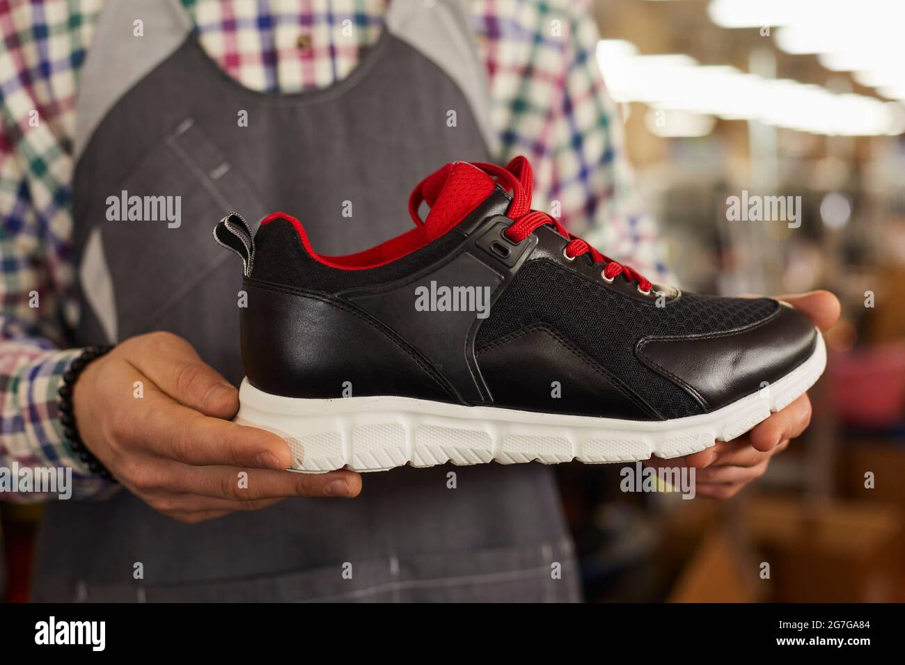 Leather sport shoe sneakers new collection presentation midsection shot ...