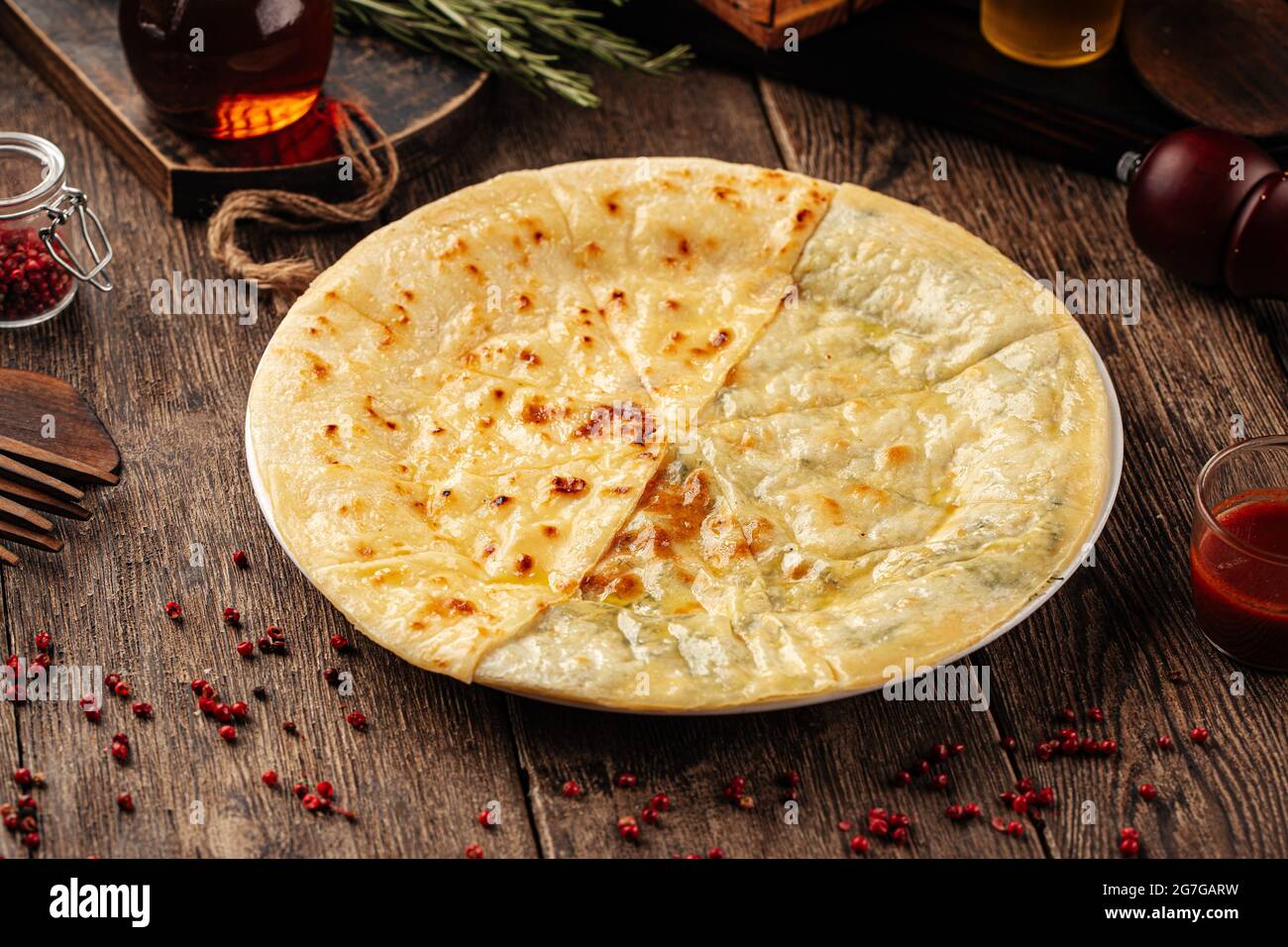 Caucasian bread khychin with cheese and greens Stock Photo - Alamy