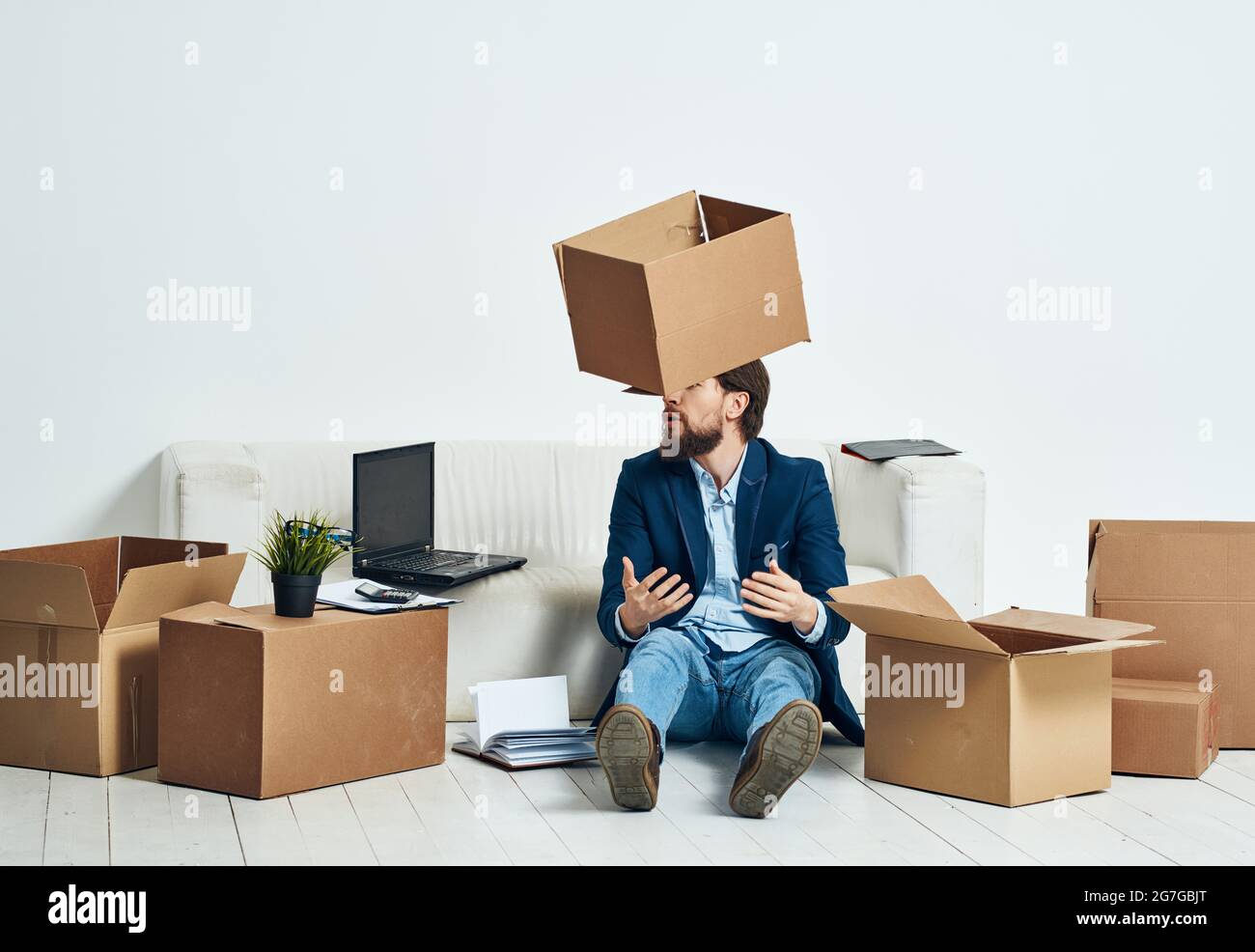 business man in the office unpacking things moving work Stock Photo - Alamy