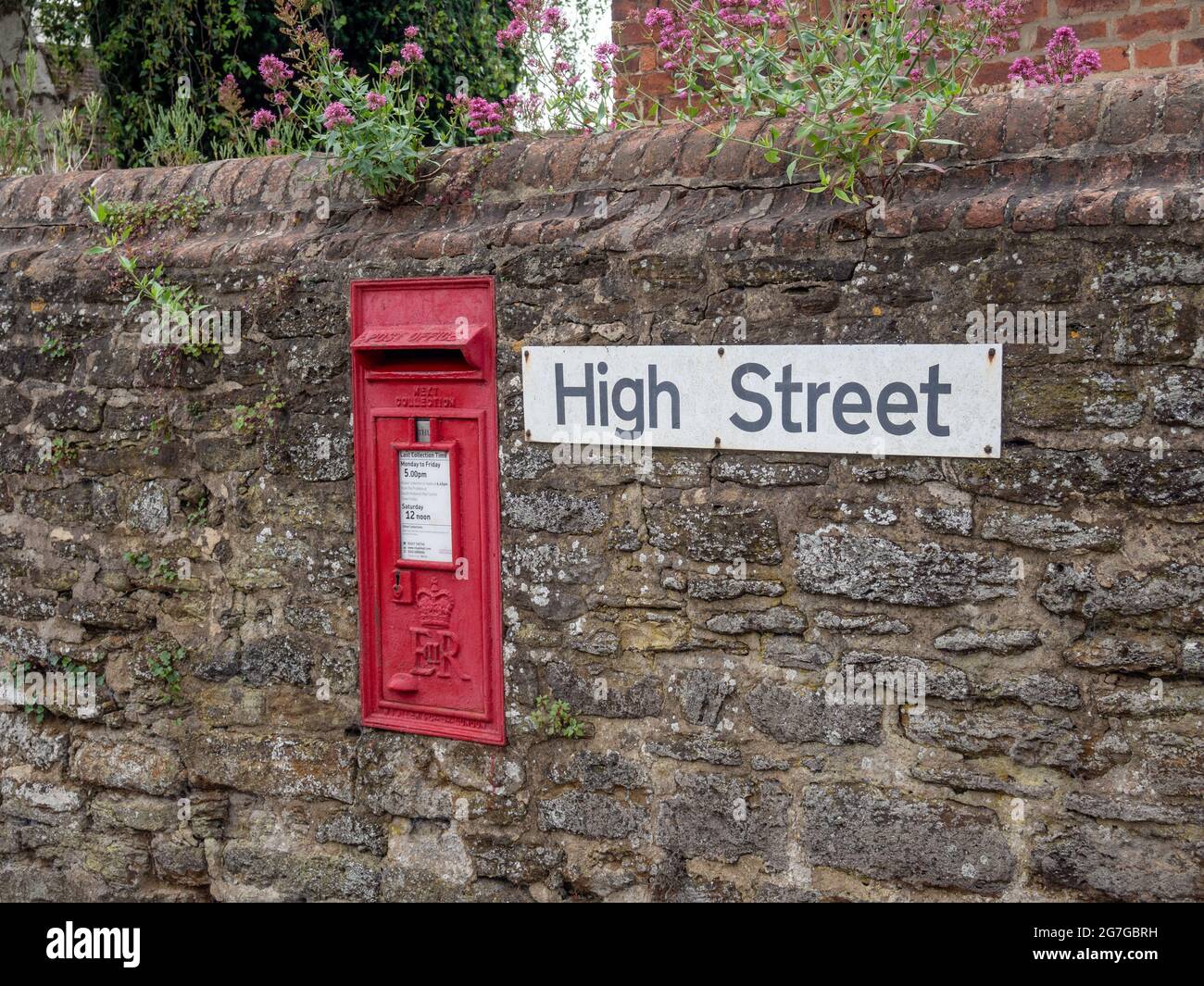 British icons, red Royal Mail post box next to a High Street sign, set ...