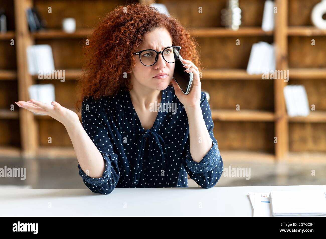 Curly brunette freelancer woman hi-res stock photography and images - Alamy