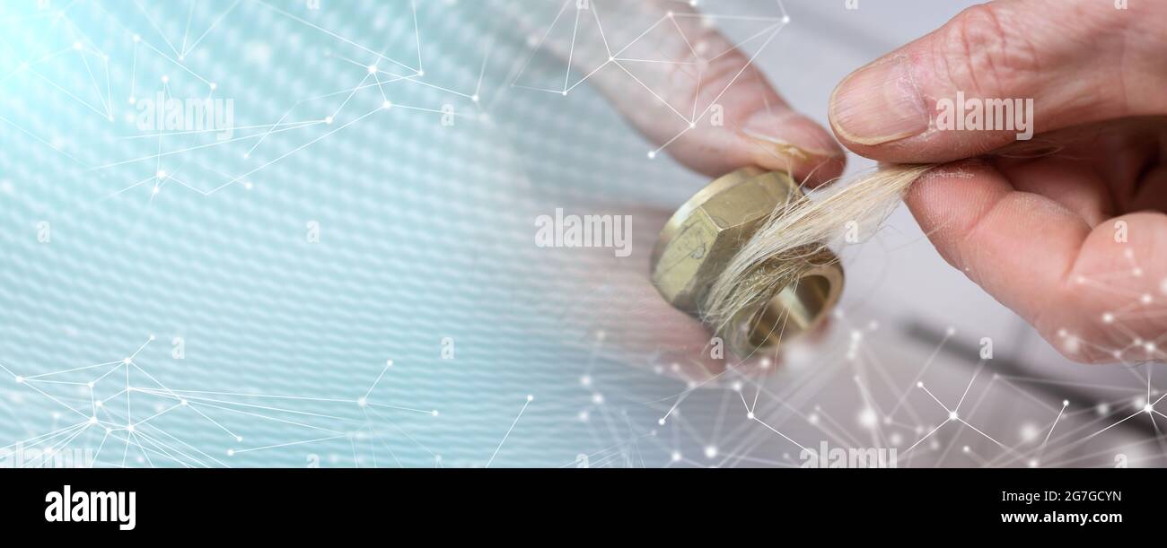 Plumber preparing fitting sealing with hemp fibers; panoramic banner ...