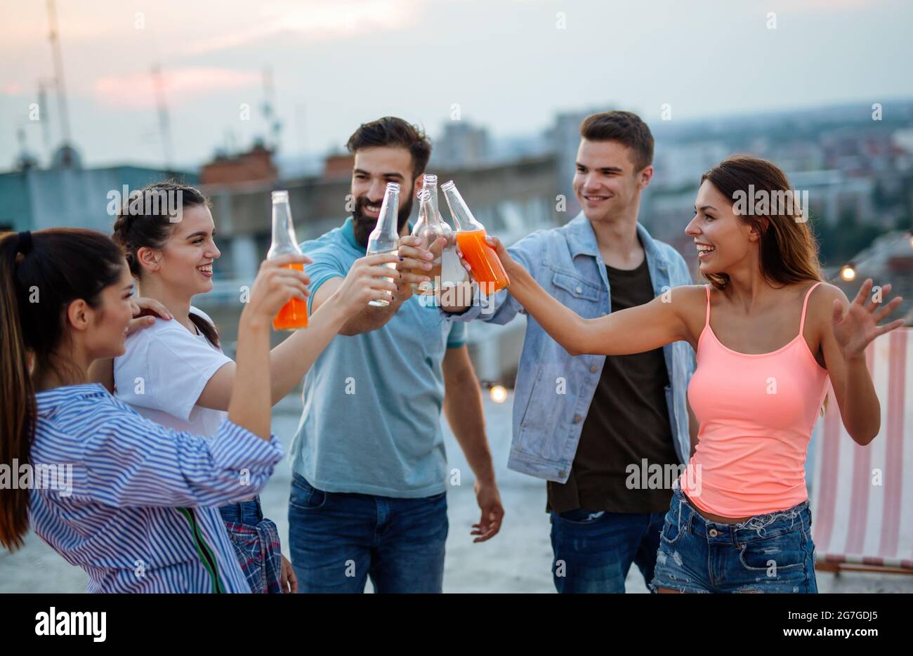 Enjoying party with friends. Group of happy people having fun together ...