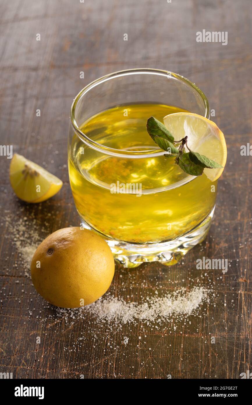 Lemonade drink surrounded by its ingrediens - Lemons, Salt and mint ...