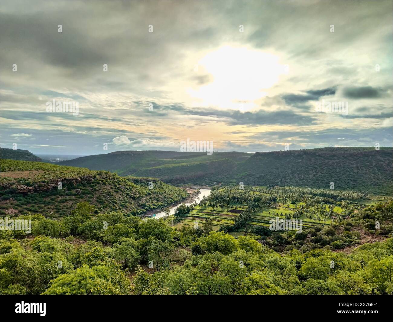 Sunrise against river, Gokak, Karnataka, India Stock Photo - Alamy