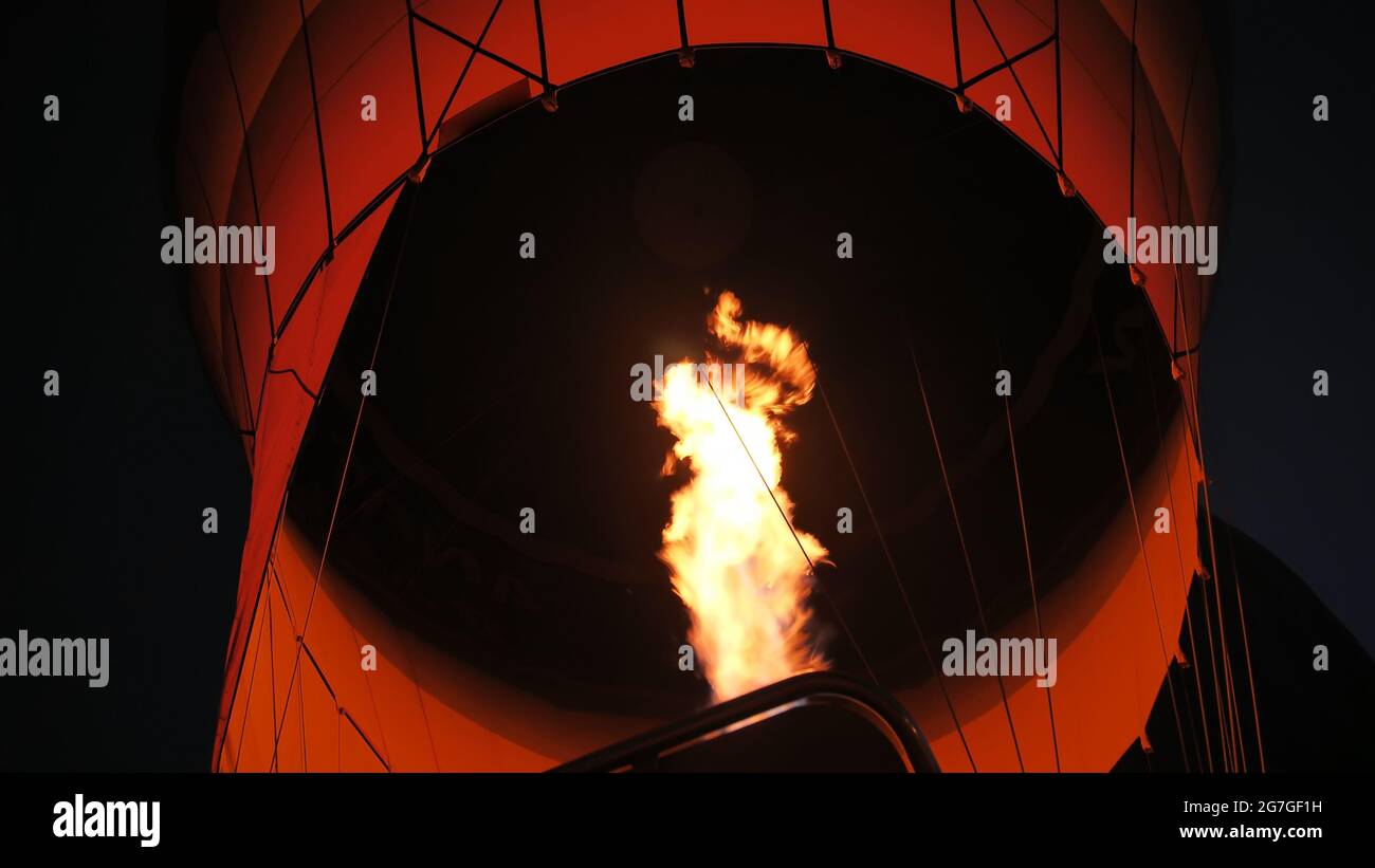 Inflating a balloon with fire. Cappadocia, Turkey Stock Photo - Alamy