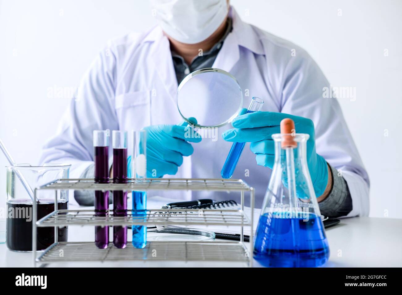 Biochemistry laboratory research, Chemist is analyzing sample in ...