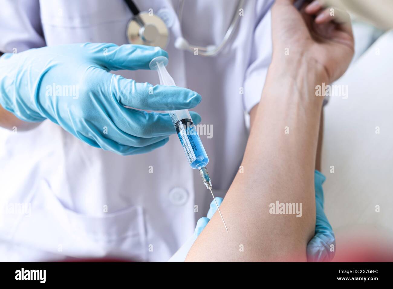 Doctor making injection vaccination patient to prevent pandemic of the ...
