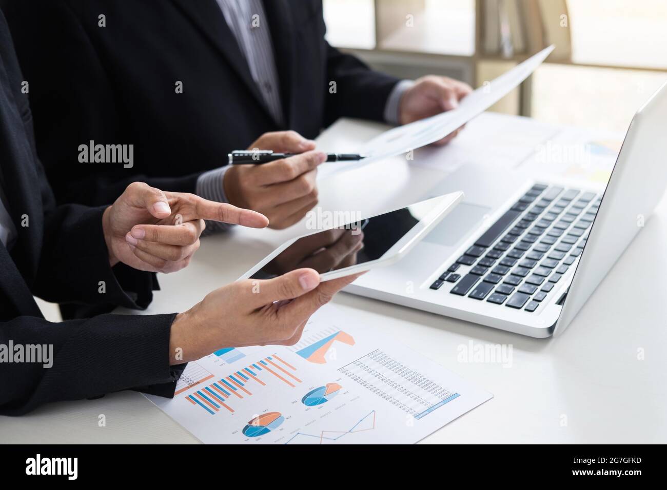 Colleagues making analysis finance hi-res stock photography and images ...