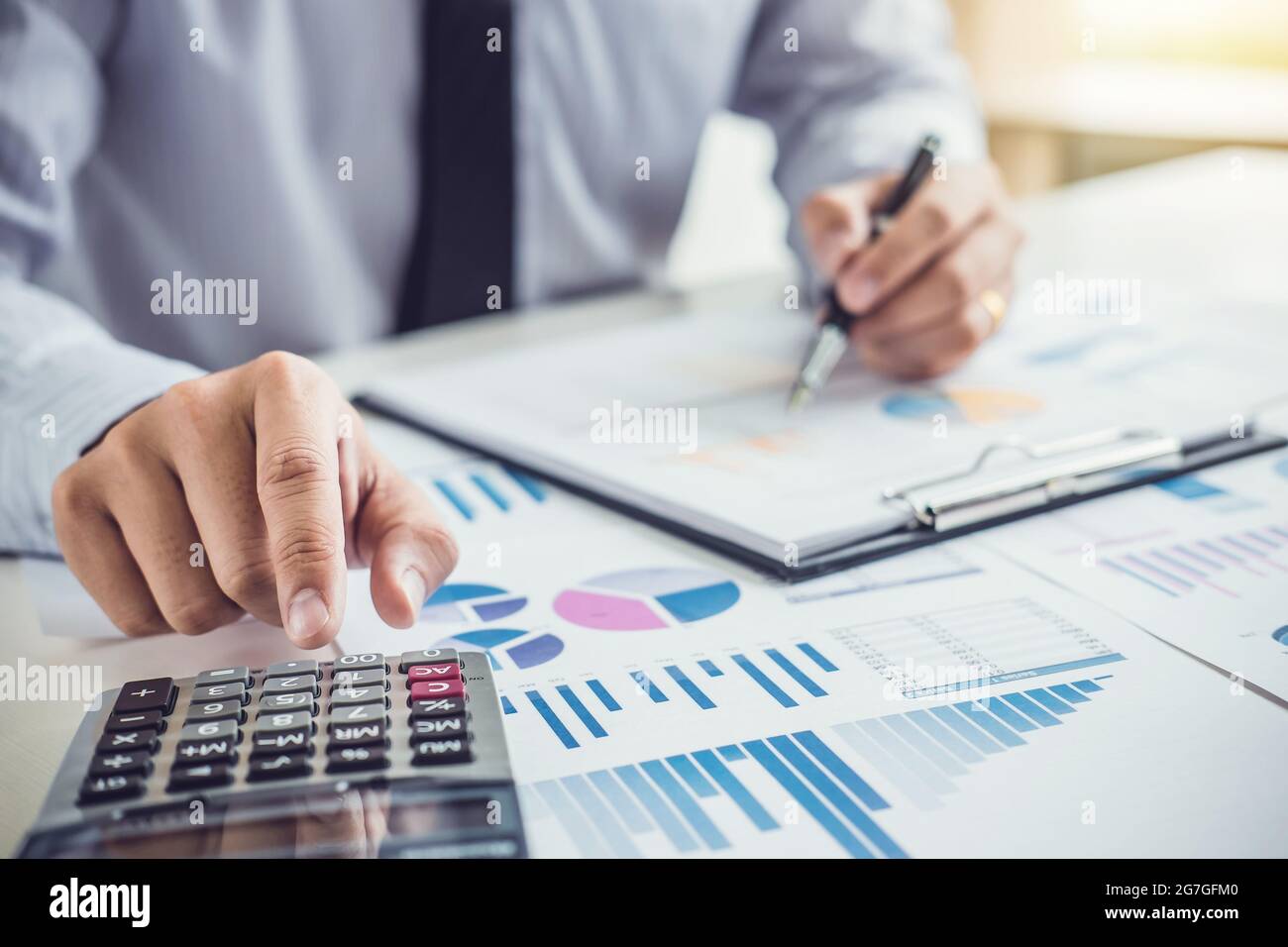 Business man or accountant working Financial investment on calculator ...