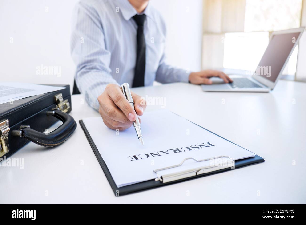 Woman signing form car hi-res stock photography and images - Alamy