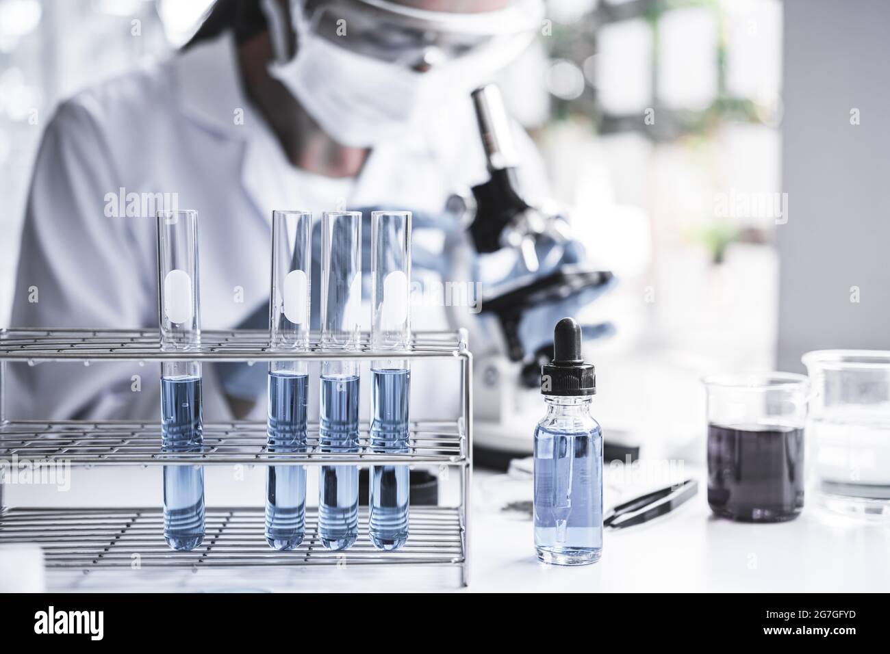 Biochemistry laboratory research, Chemist is analyzing sample in ...
