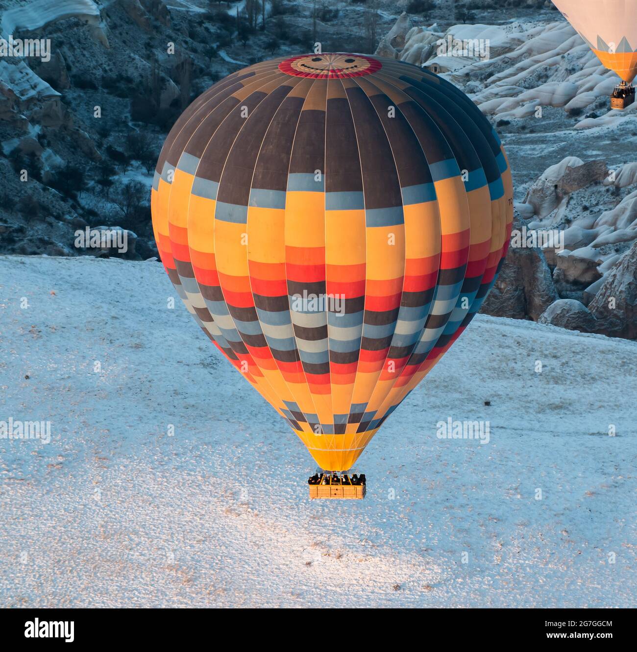 Colorful balloons over volcanic rocks in Cappadocia. Turkey Stock Photo ...
